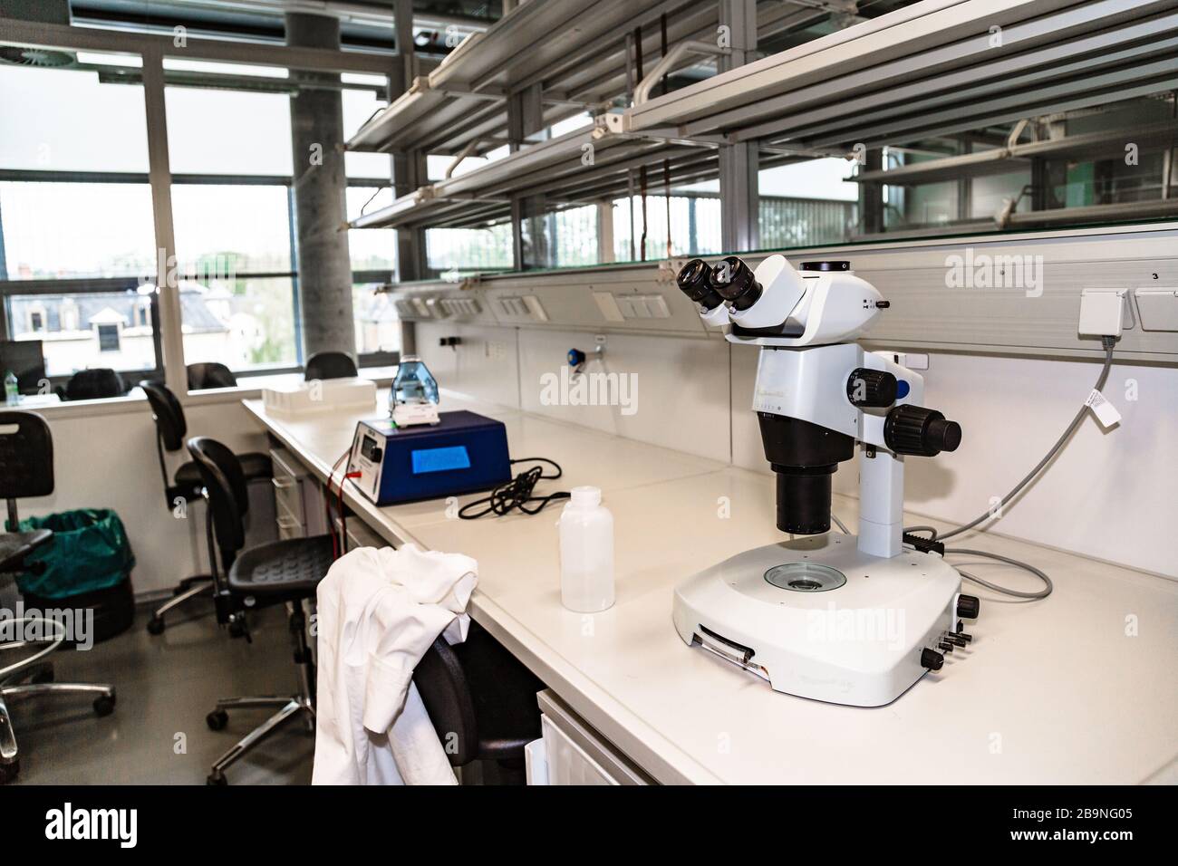 Microscope stands on laboratory table hi-res stock photography and ...