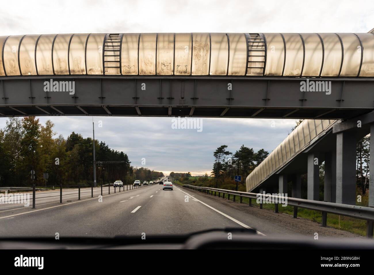 Pedestrian crossing. Highway, photo from the car. High, dirty crossing ...
