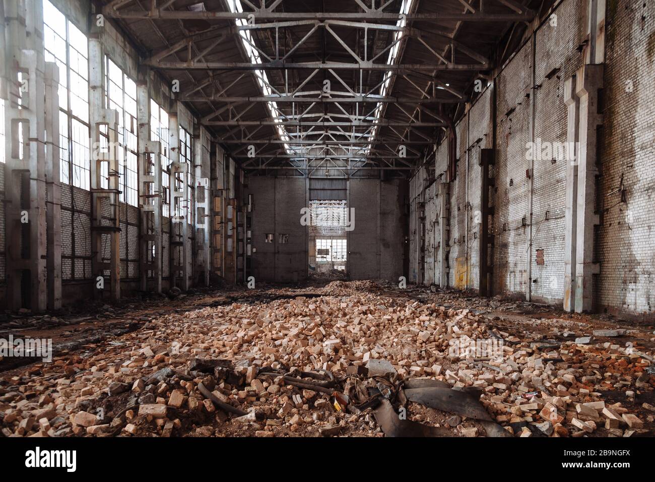 Abandoned large industrial hall with garbage waiting for demolition ...