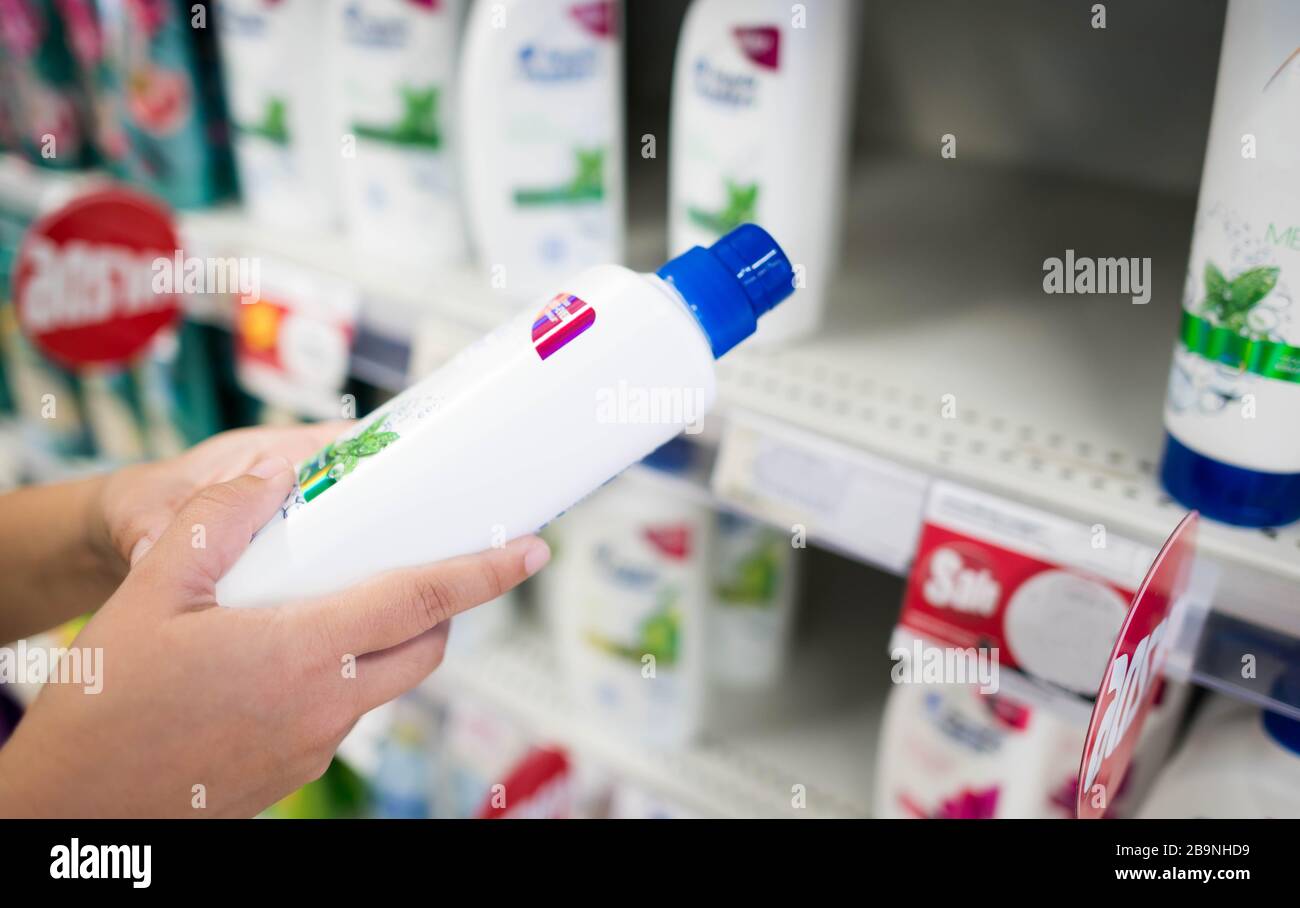 BANGKOK, THAILAND- MARCH 15 2020: Woman hand holding shampoo bottle and ...