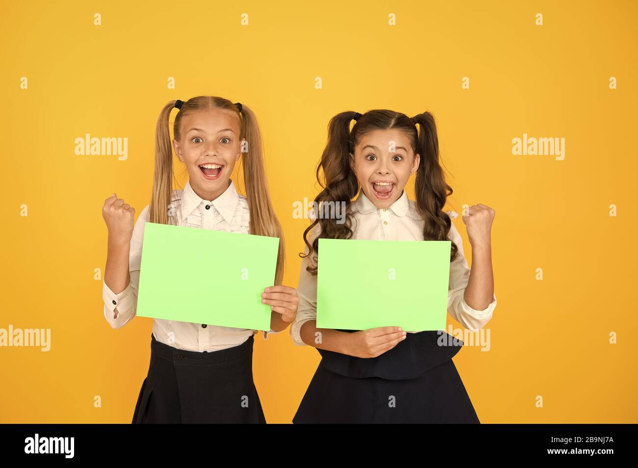 Homework done. Happy small children holding empty homework sheets on ...