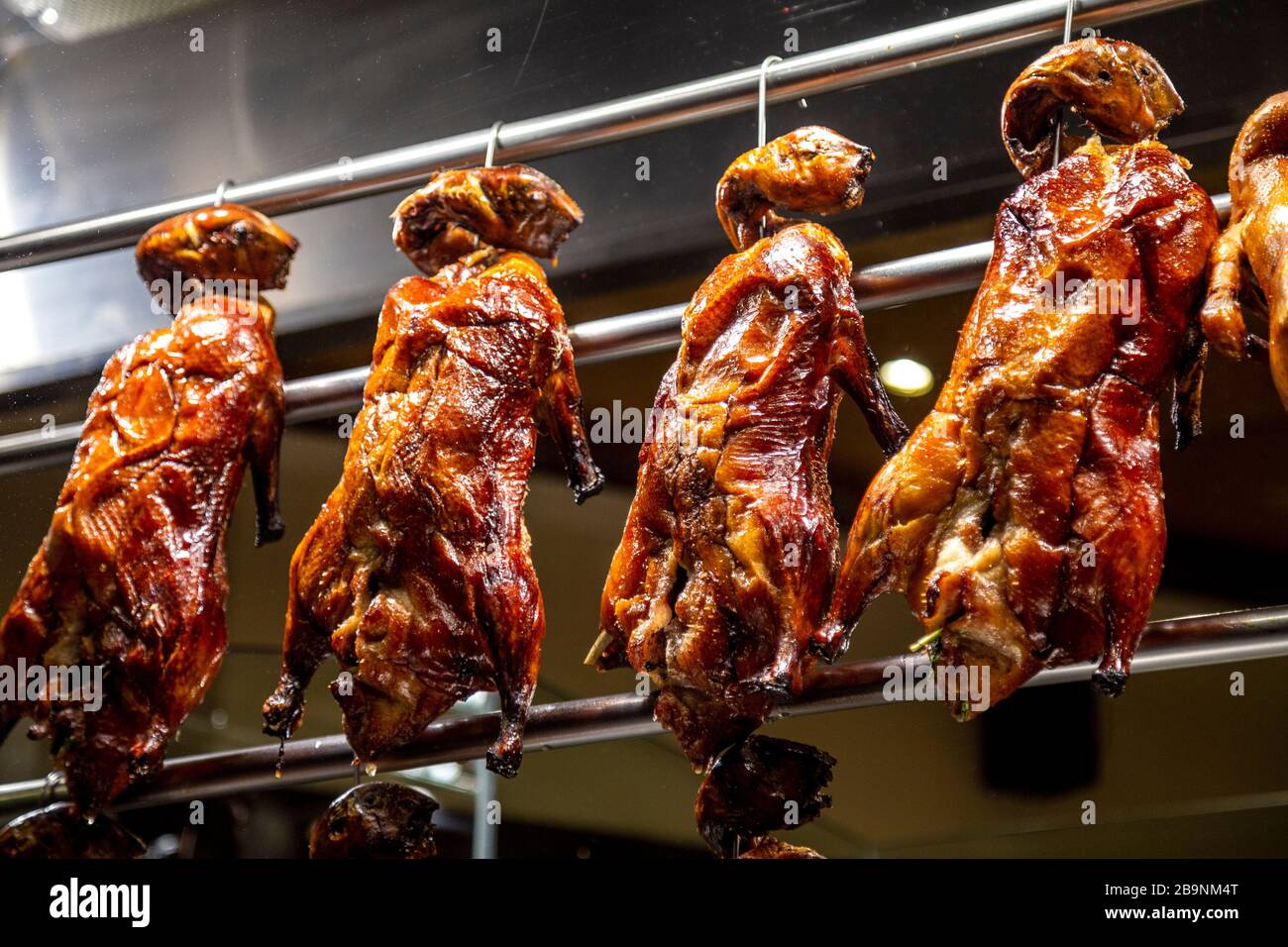Delicious crispy roast ducks hanging in the display window of Lotus ...