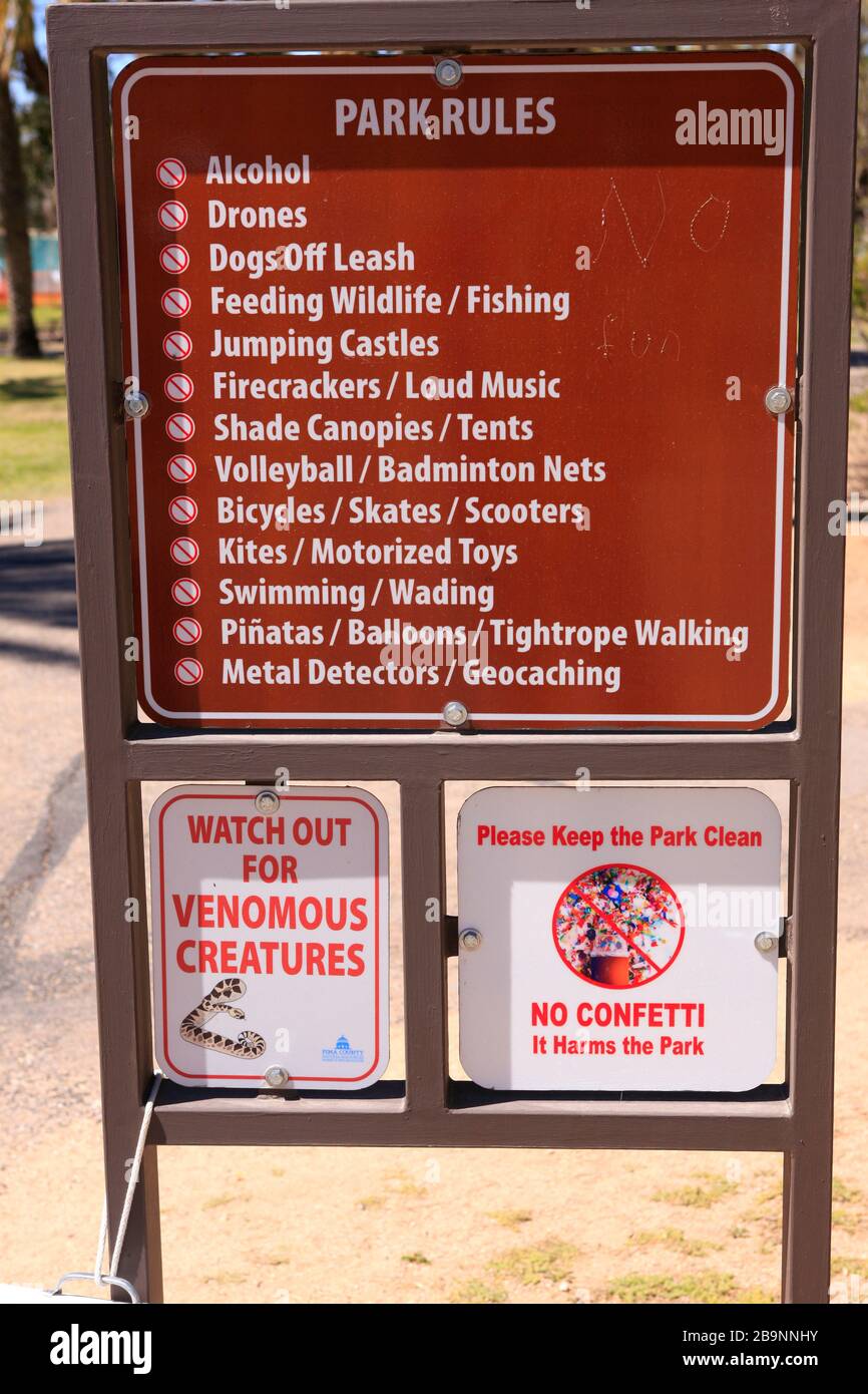 Park rules and a notice to watch out for venomous creatures at Agua ...