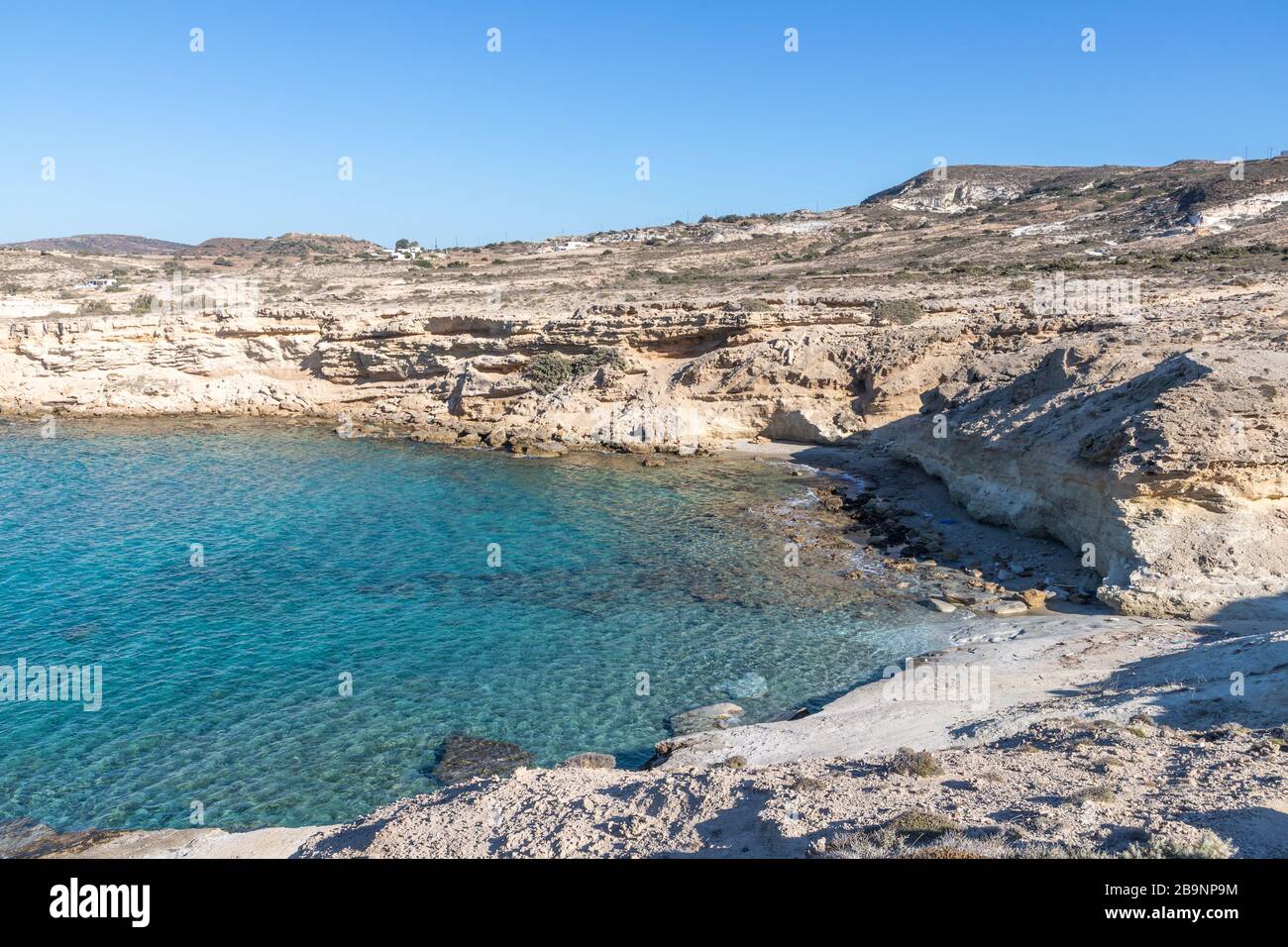 Cliffs and rocks in Mytakas beach, Milos, Greece Stock Photo - Alamy