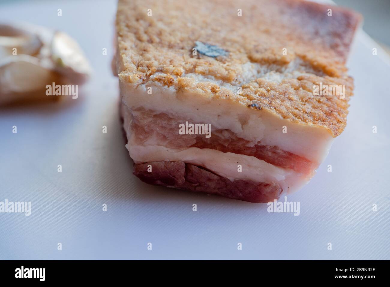 Garlic and bacon.Bacon and garlic. Bacon and garlic on a table on a ...