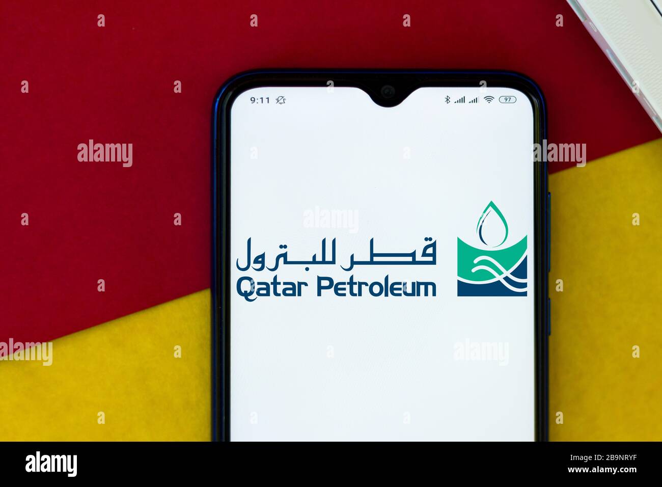 In this photo illustration a Qatar Petroleum logo seen displayed on a ...