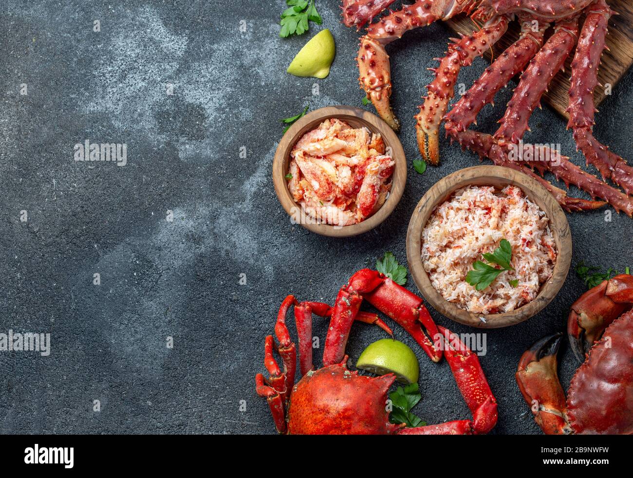 Crabs seafood background with crabs selections and crab meat on black ...