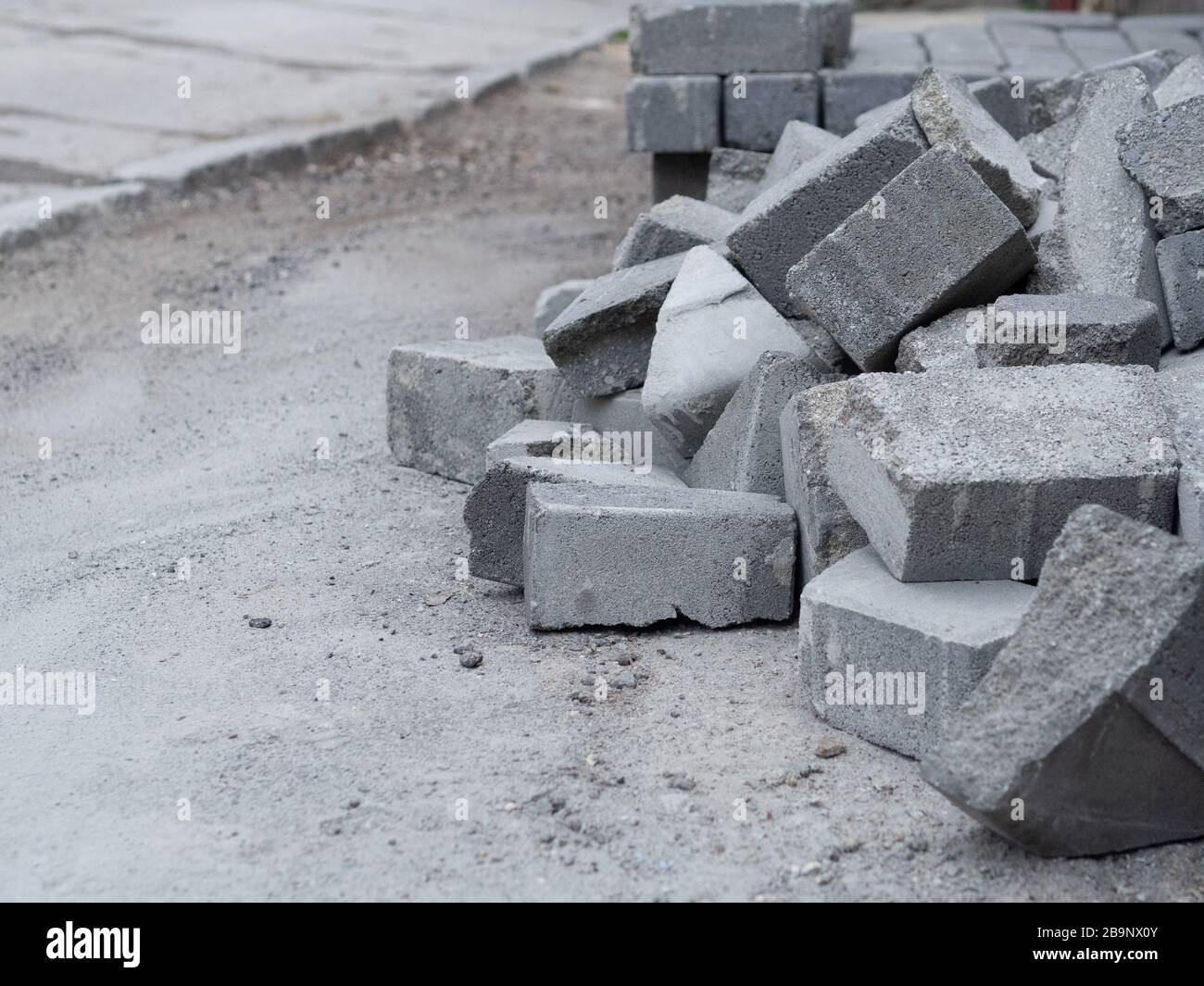 A pile of stone tiles on the street in the city, reconstruction ...