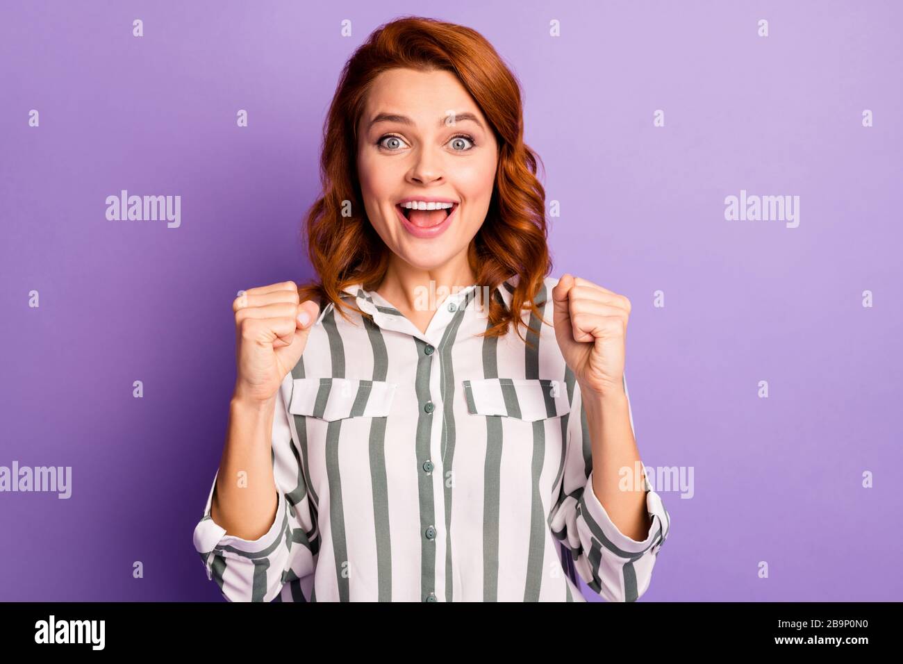 Portrait of funny finky woman win lottery impressed raise fists scream ...
