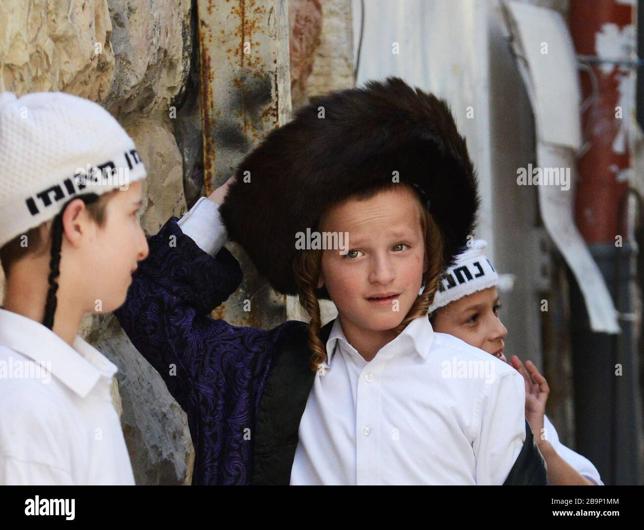A young Hassidic Jewish boy dressed as an older Hassidic Jewish man for ...