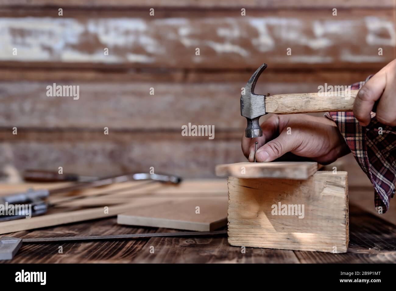 Carpenter working in carpentry shop. Woodwork for furniture and home ...