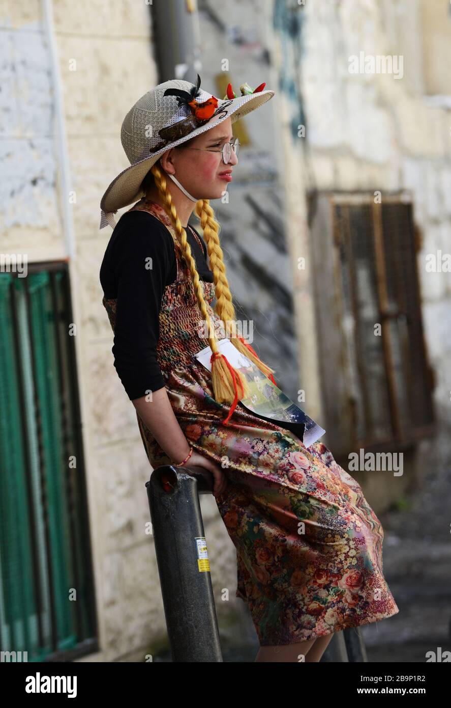 A Hasidic girl wearing a costume for Purim Jewish holiday in Mea ...