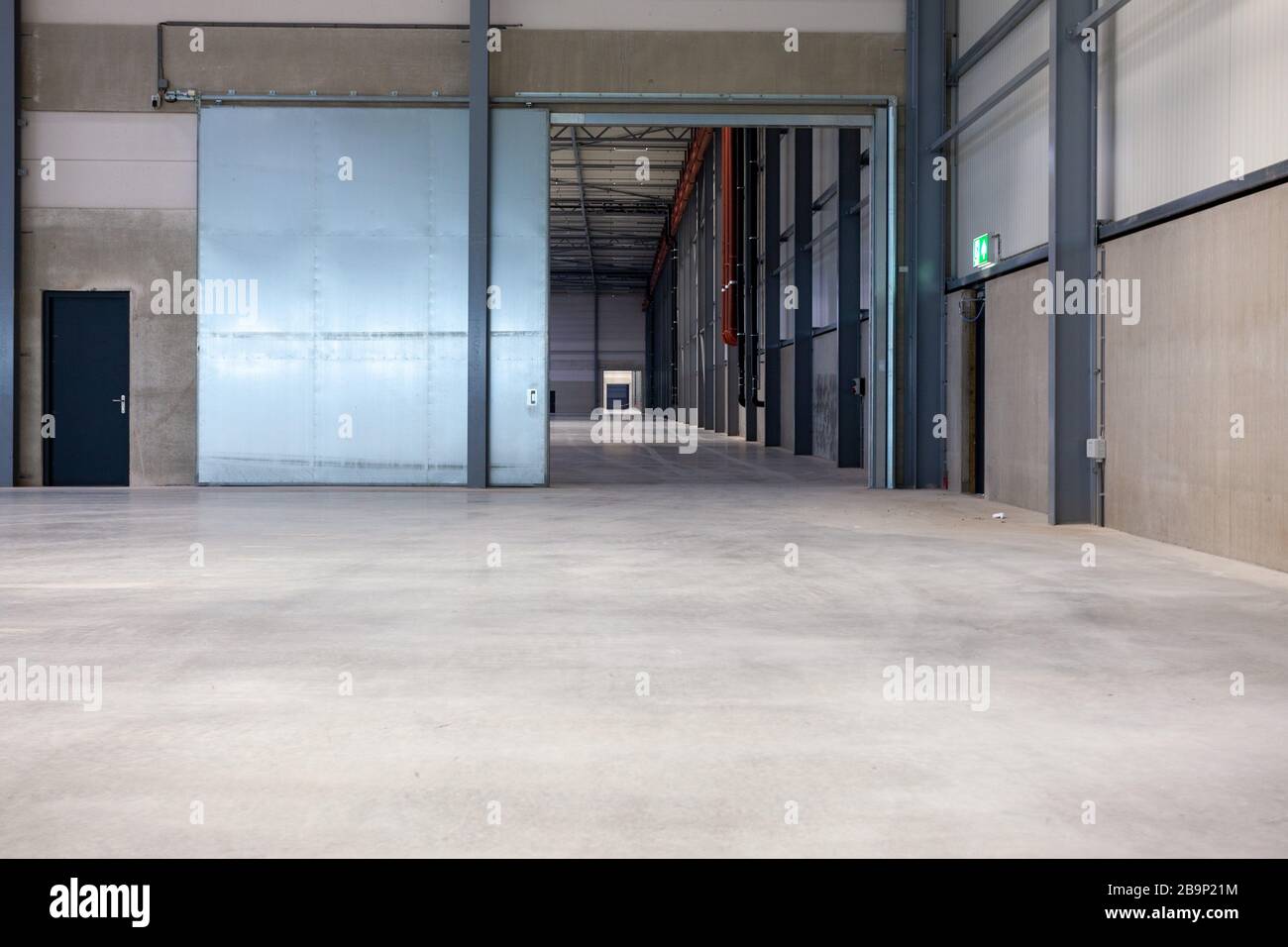 Interior shot of a sliding door inside a warehouse Stock Photo - Alamy