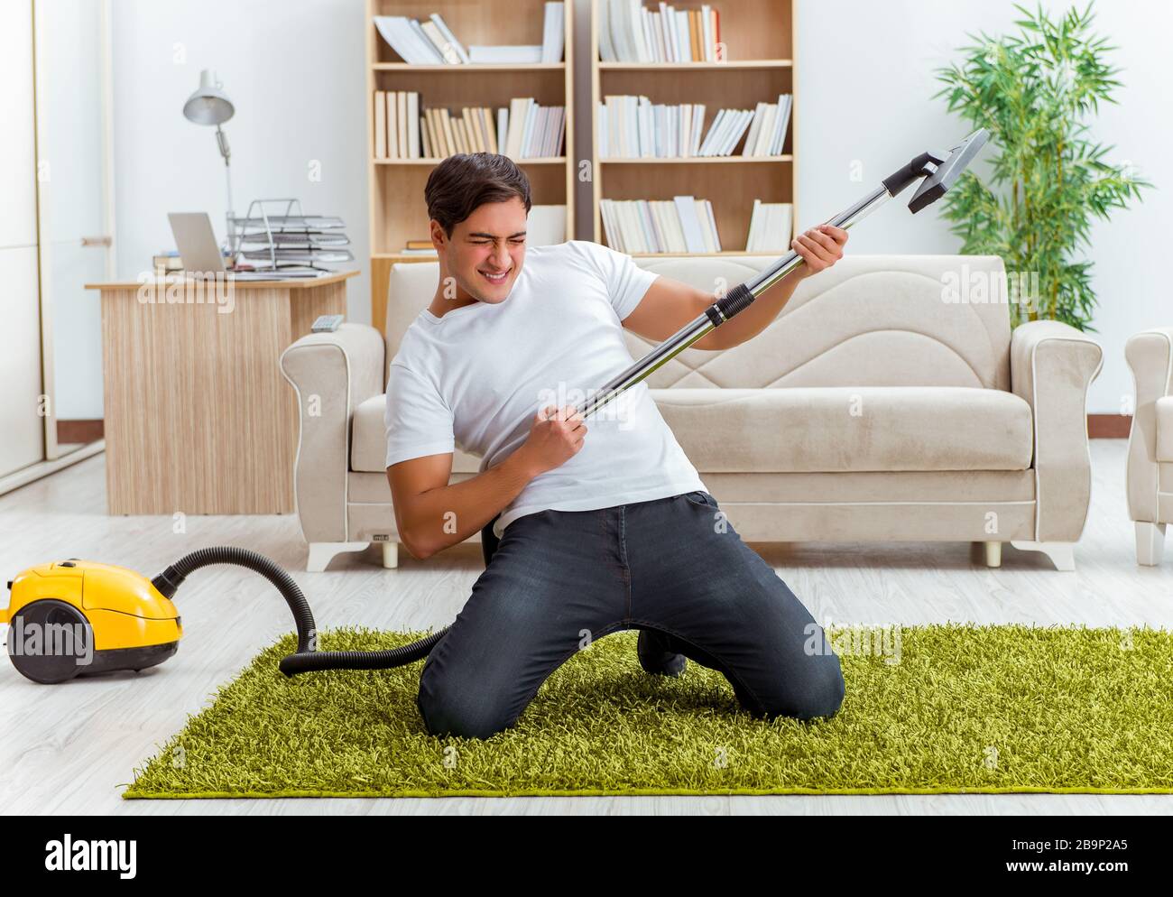 The man husband cleaning the house helping wife Stock Photo - Alamy