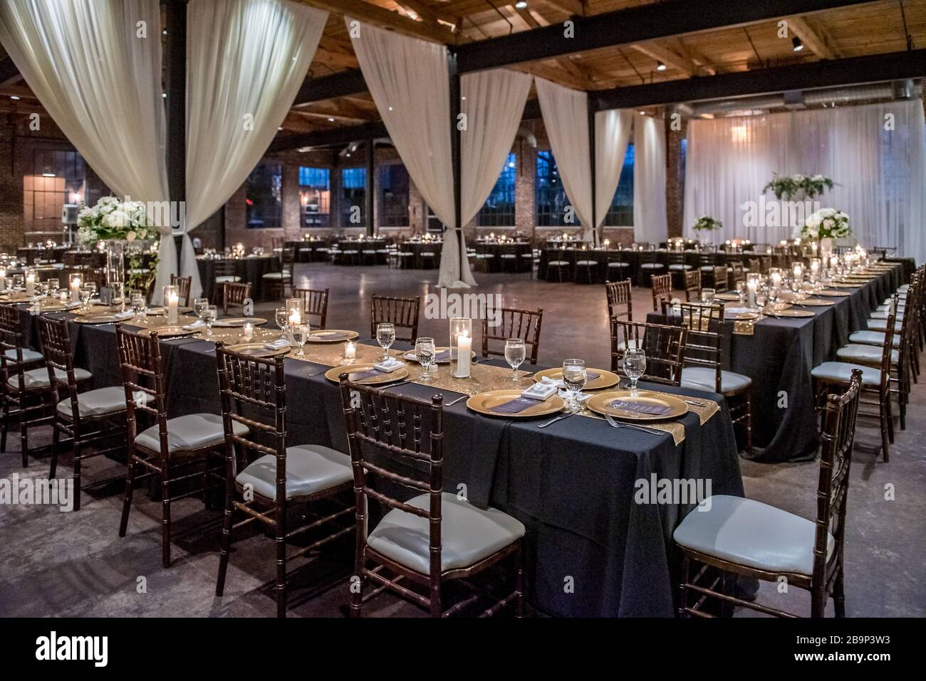 Beautiful wedding hall with elegant table setting Stock Photo - Alamy