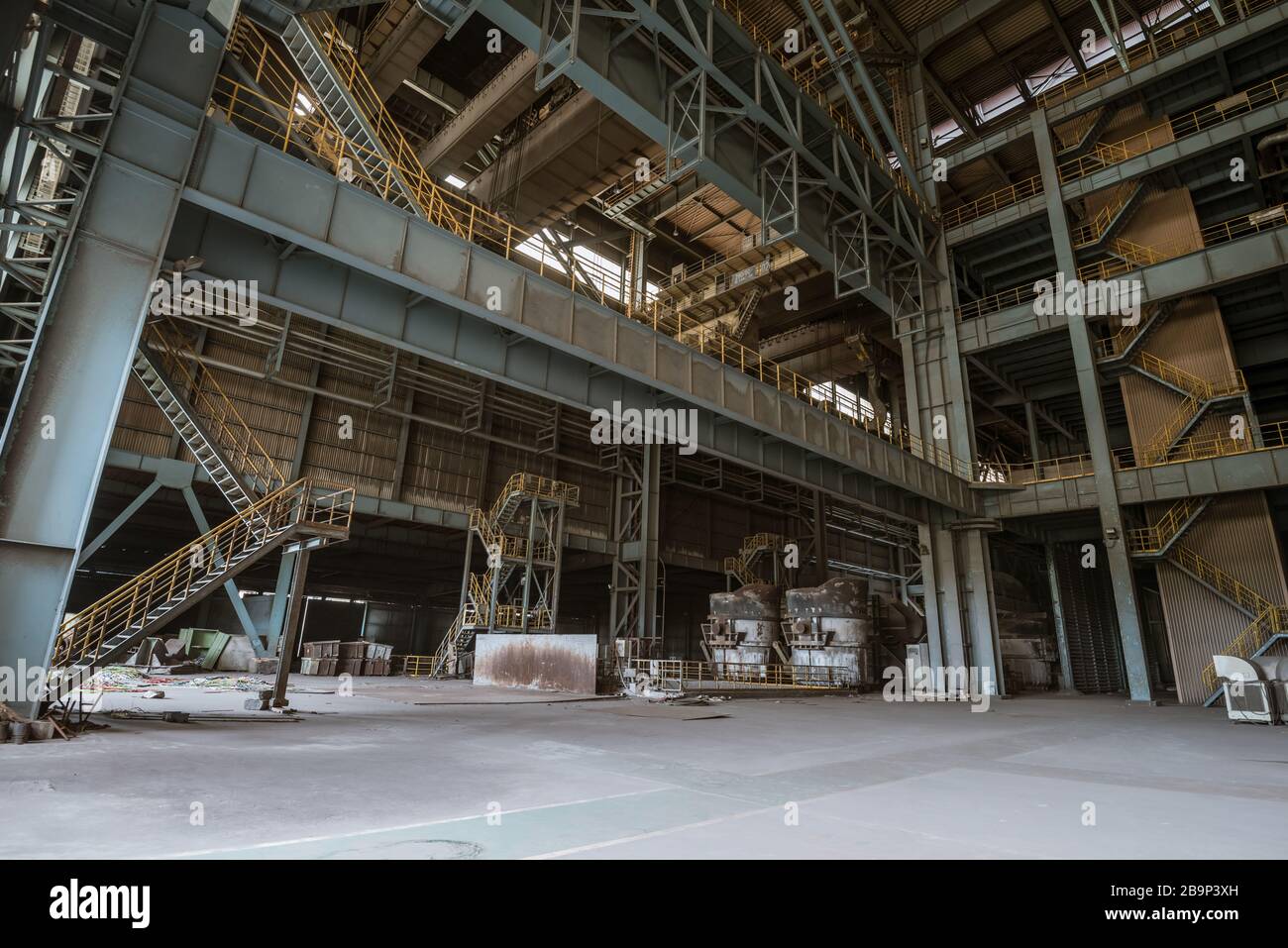 Interior of an old abandoned industrial steel factory Stock Photo - Alamy