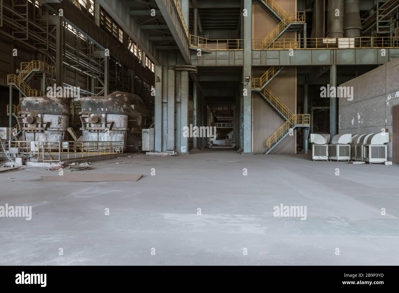 Interior of an old abandoned industrial steel factory Stock Photo - Alamy