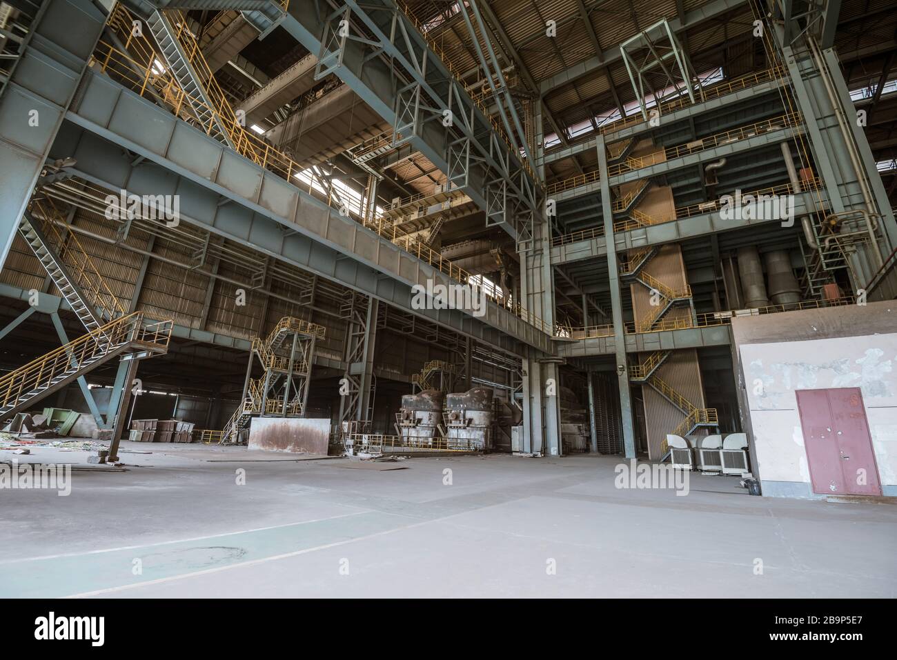 Interior of an old abandoned industrial steel factory Stock Photo - Alamy