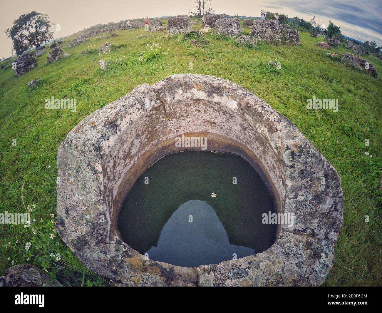 Wide eye view of meadow, big rock jar in Plains of Jars, historical ...
