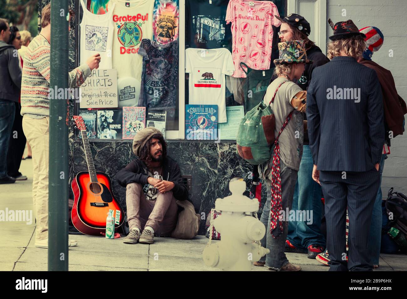 Preppy tourist taking a picture of locals in costumes in Haight-Ashbury ...