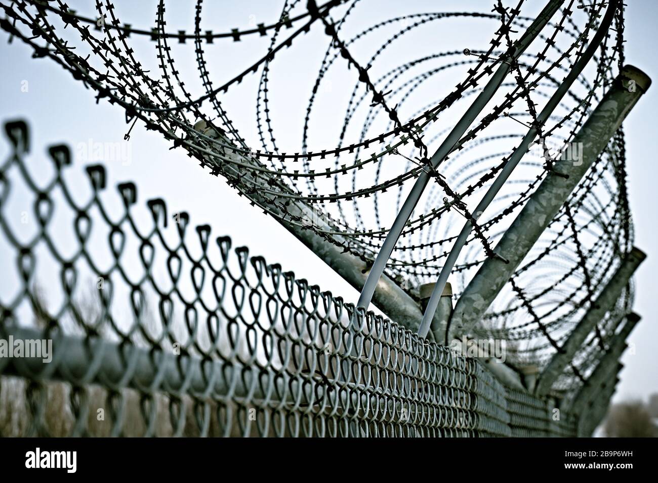 Border fence with barbed wire. Closing for quarantine. Maximum Security ...