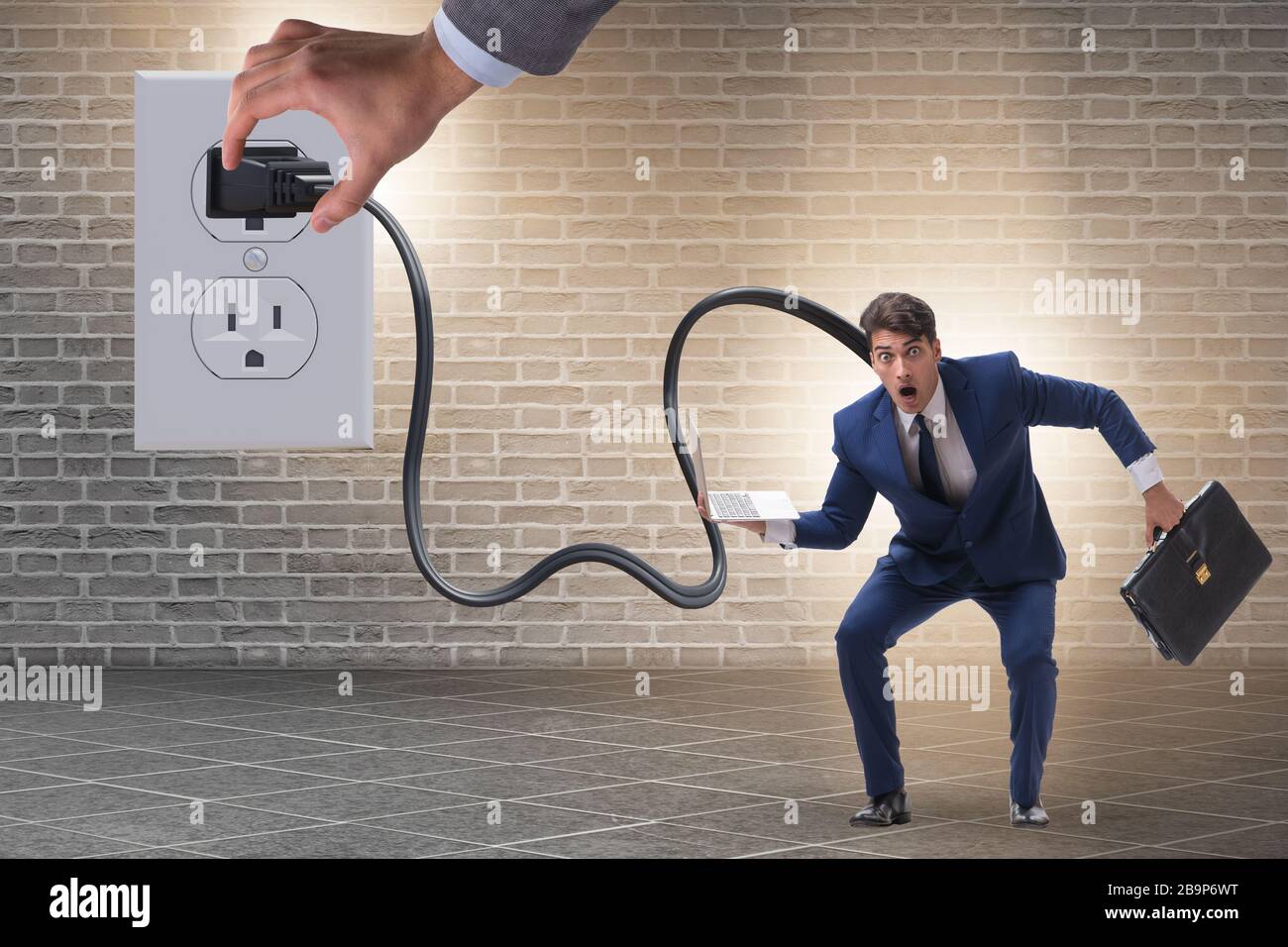 The businessman being powered by electricity and plug Stock Photo - Alamy
