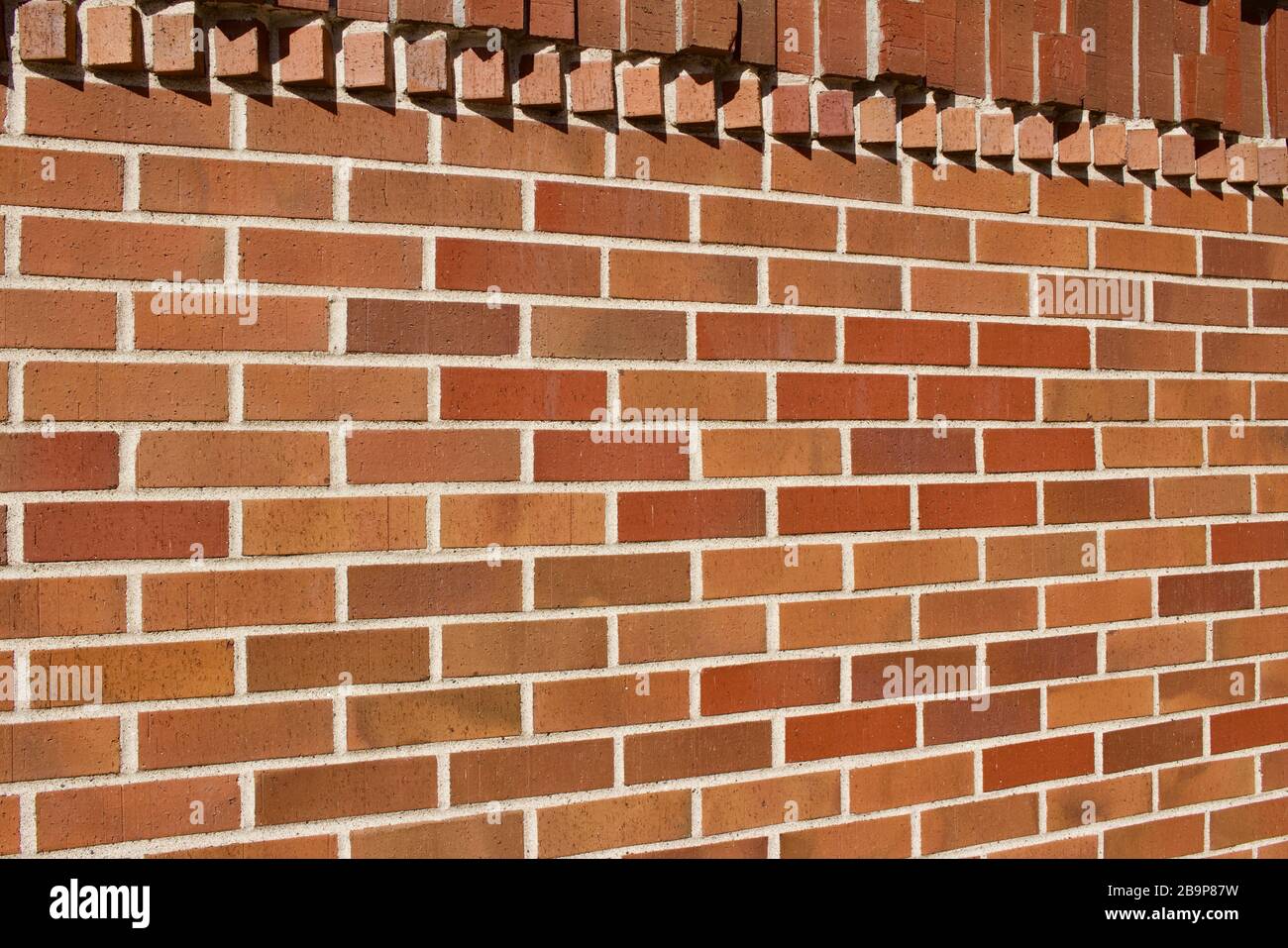 Protruding bricks in geometric shapes decorate the top of this ...