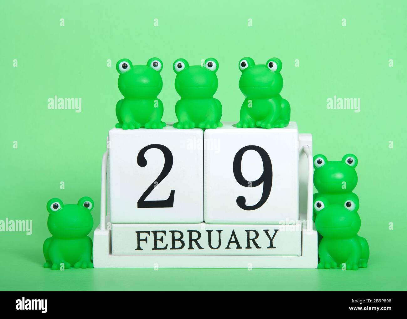 White calendar blocks February 29 on green background with generic ...