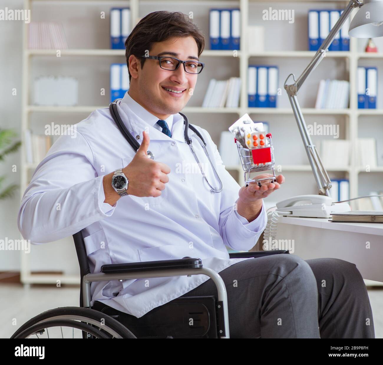The disabled doctor on wheelchair working in hospital Stock Photo - Alamy