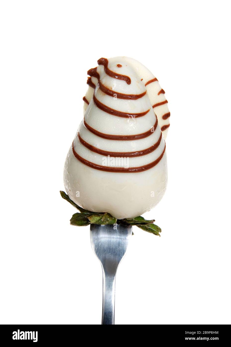 White chocolate covered strawberry drizzled in milk chocolate on a ...