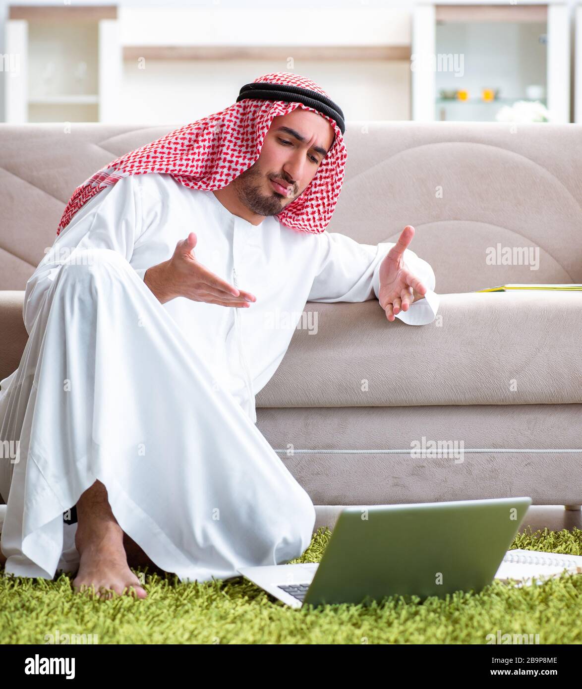 The arab man working at home on his work Stock Photo - Alamy