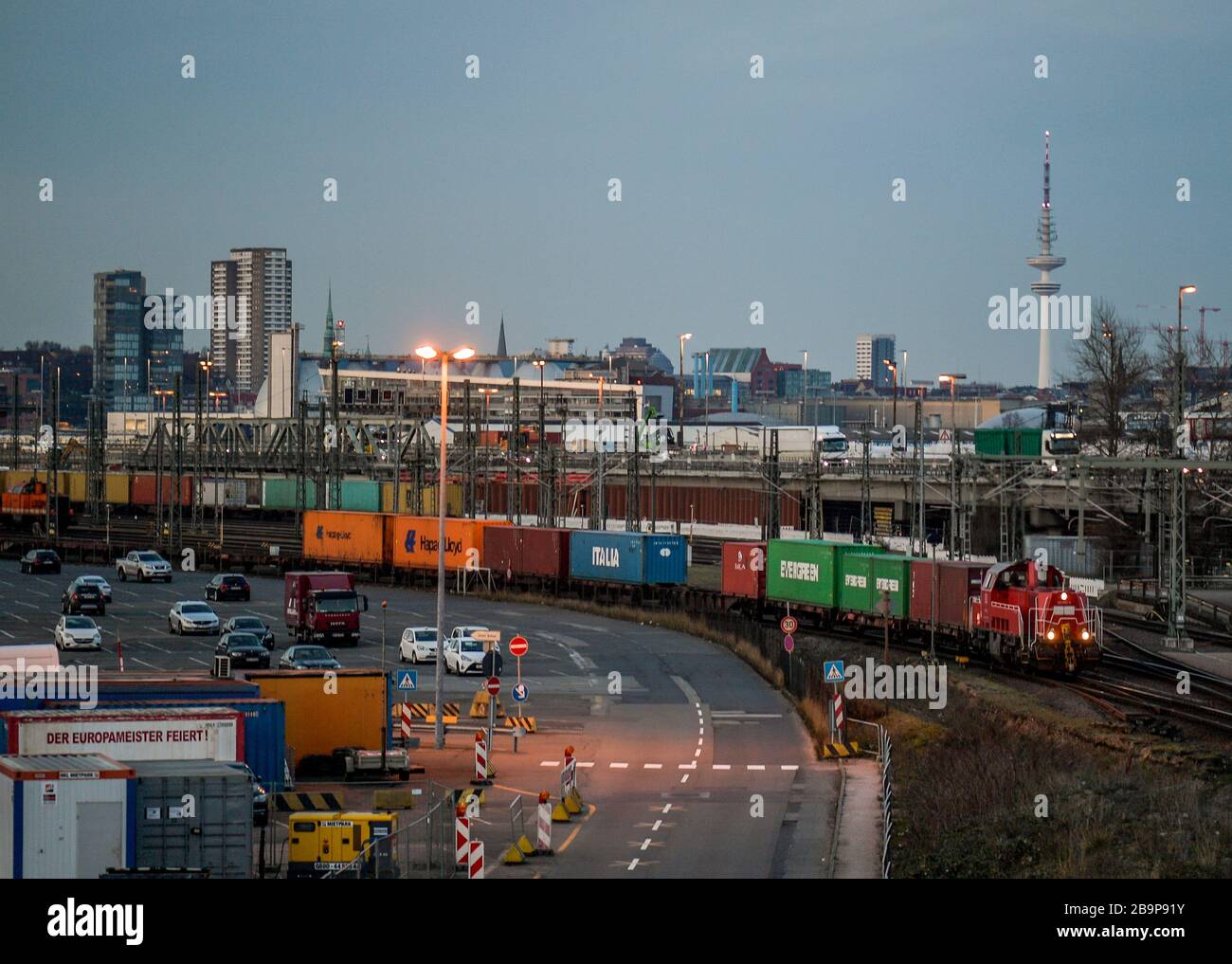 Hamburg, Germany. 24th Mar, 2020. A train loaded with containers leaves ...