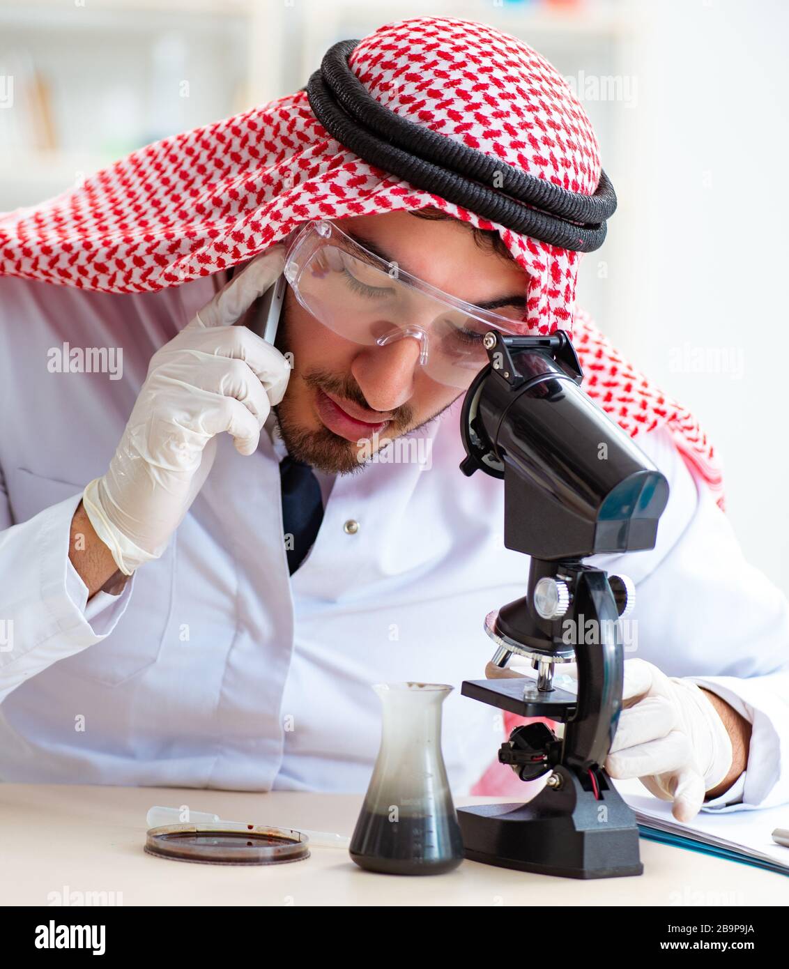 The arab chemist scientist testing quality of oil petrol Stock Photo ...