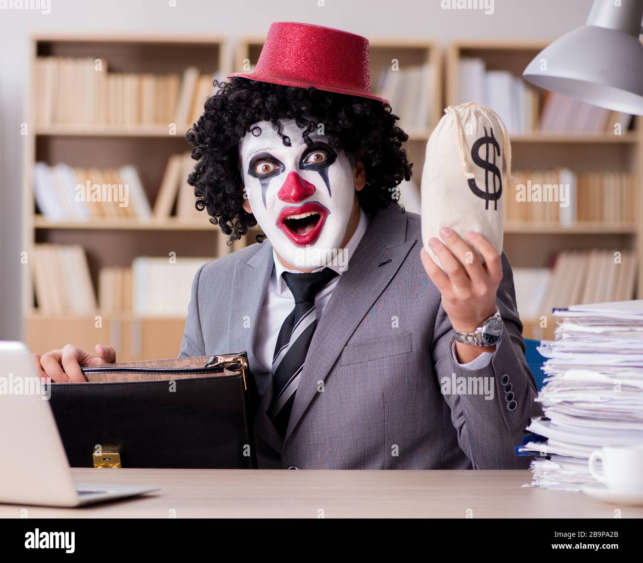 The clown businessman working in the office Stock Photo - Alamy