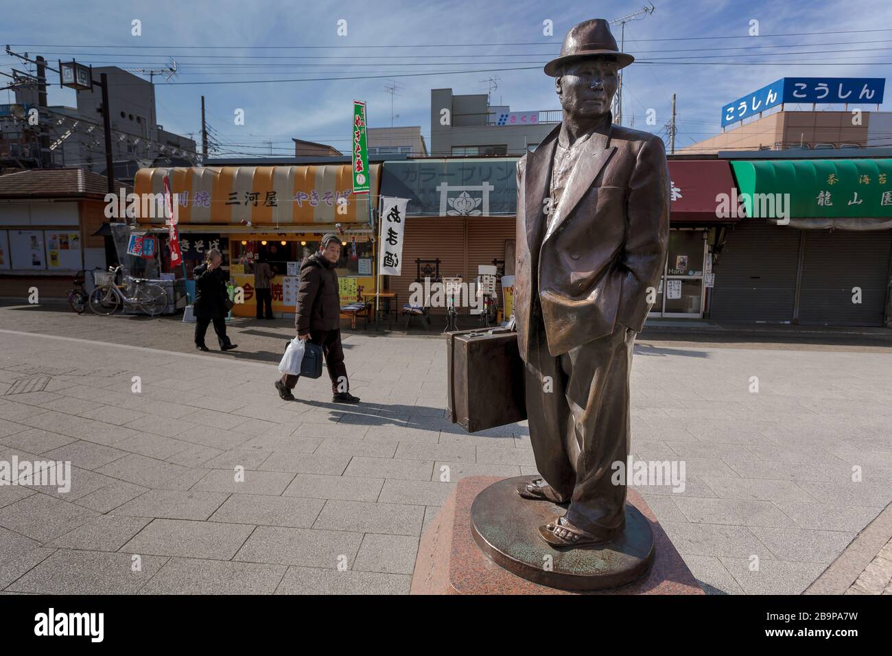 Statue of famous TV character Tora San outside the station in Shibamata ...