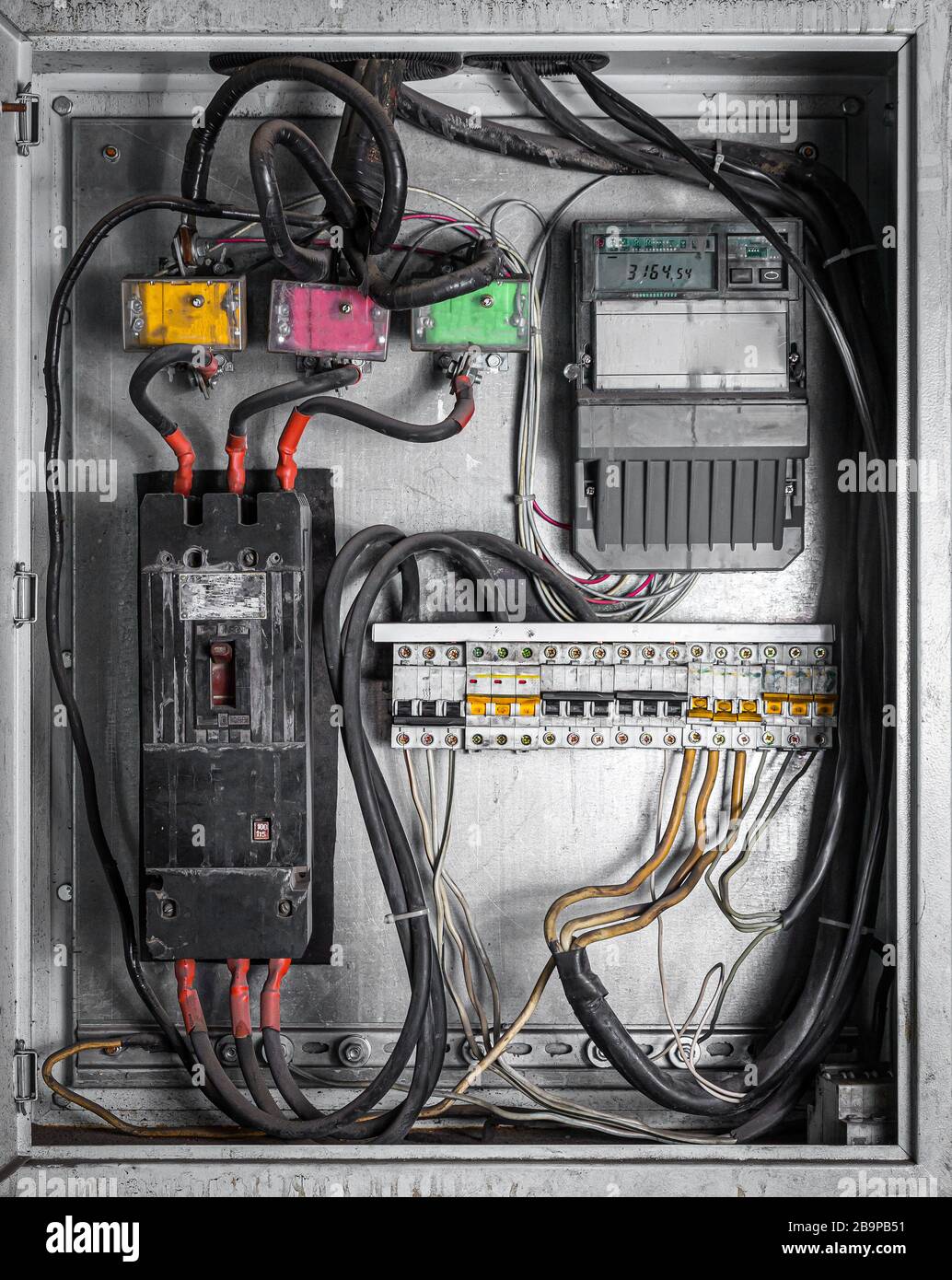 Close-up of an old white dirty control panel, kilowatt hour electricity ...
