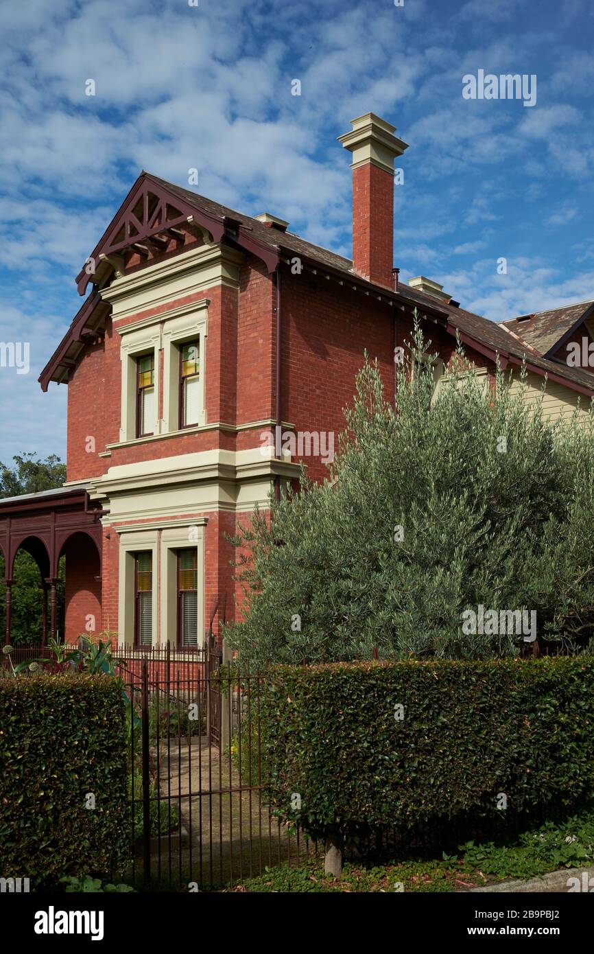 A cute, small, red brick cottage, house in the Royal Botanic Gardens ...