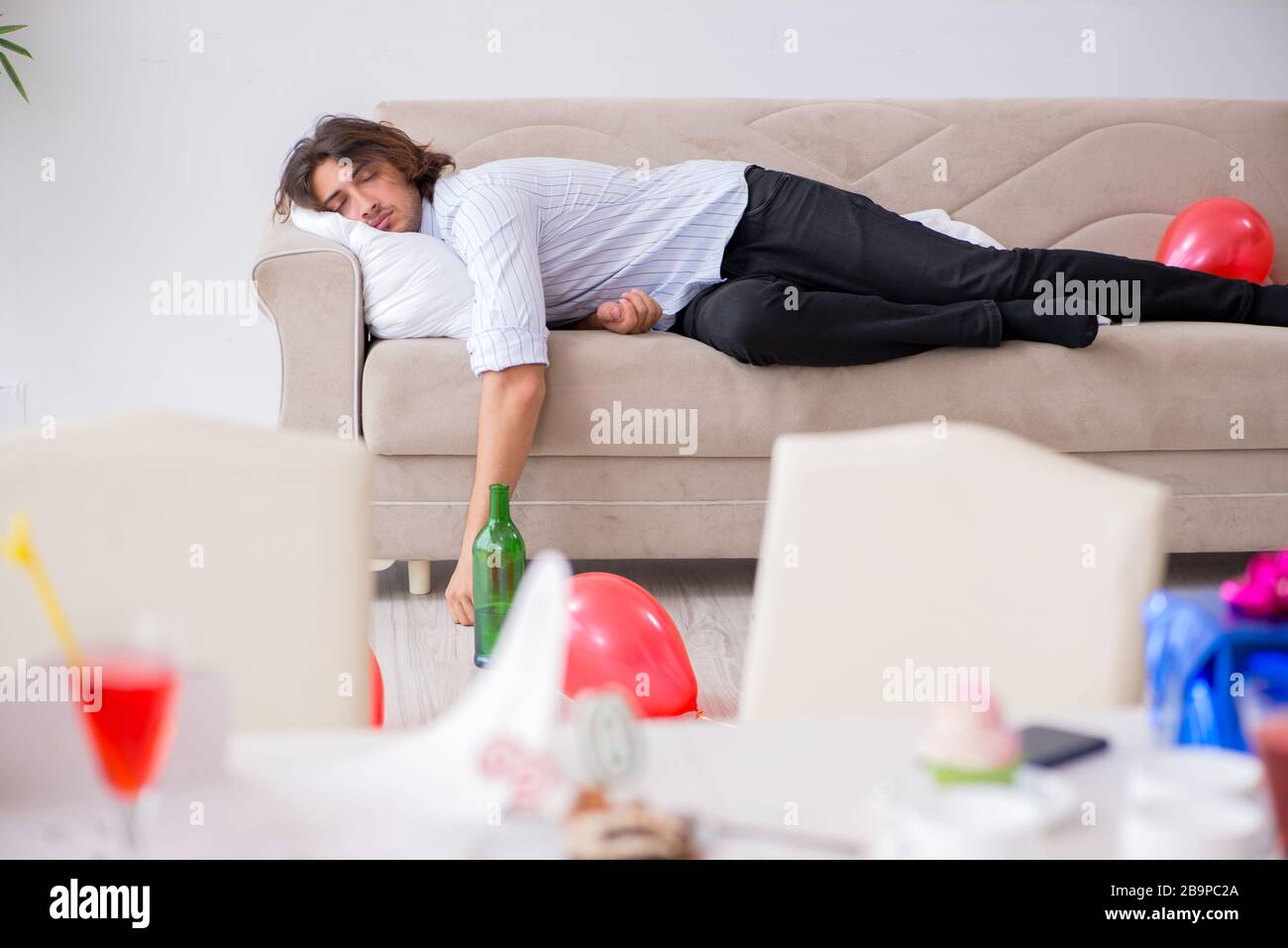 The young man celebrating his birthday at home Stock Photo - Alamy