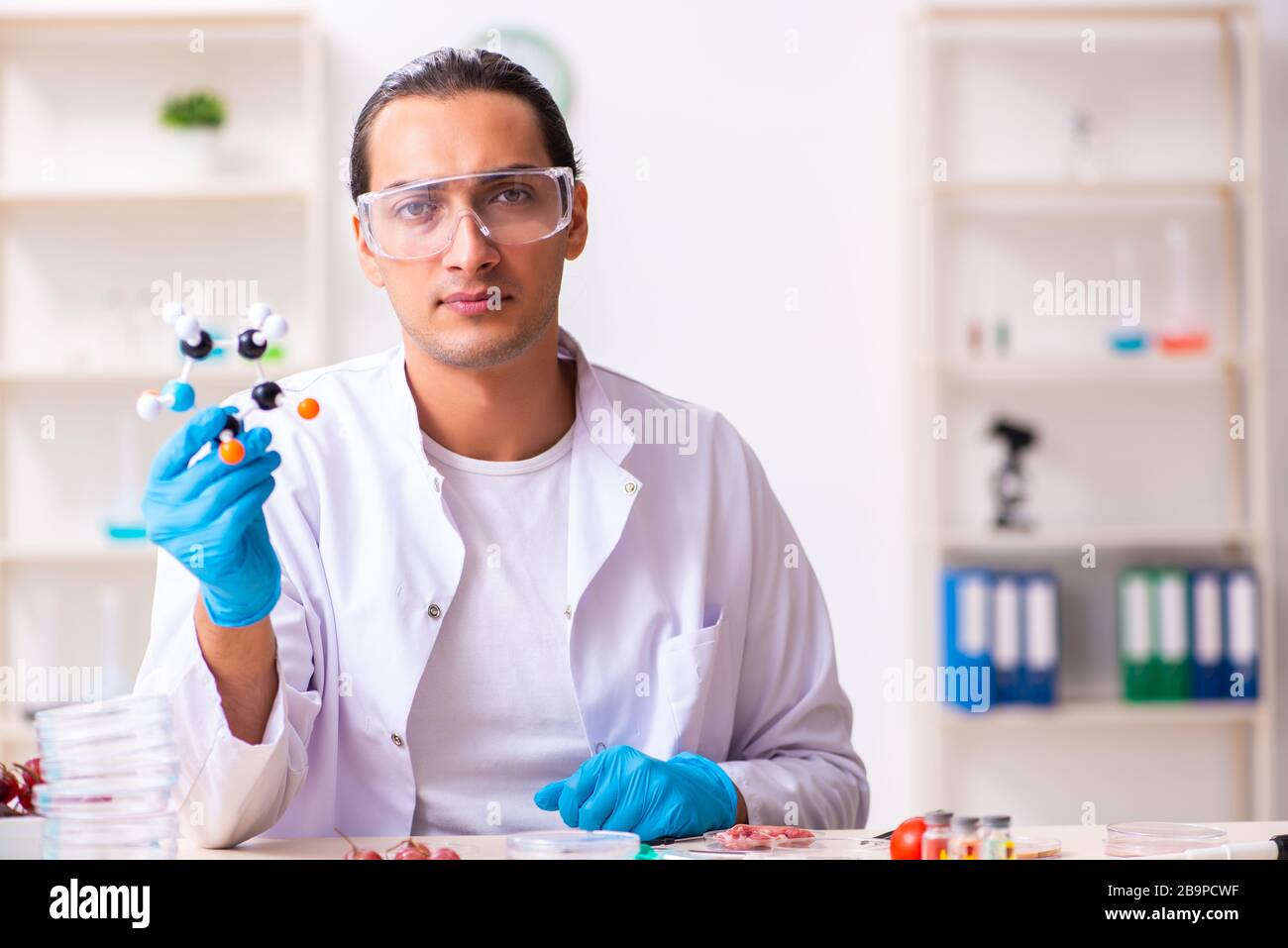 Young nutrition expert testing food products in lab Stock Photo - Alamy