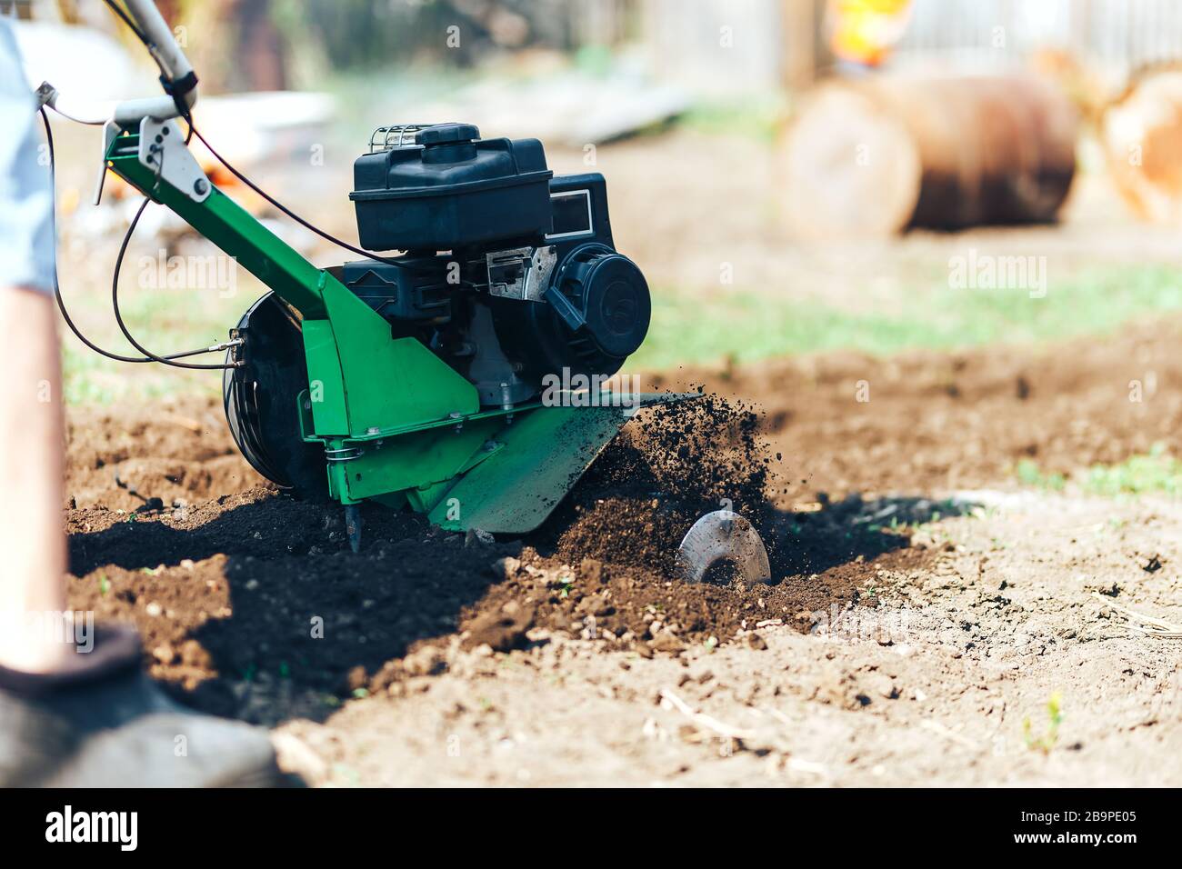 close up photo of young farmer gardener cultivate ground soil ...