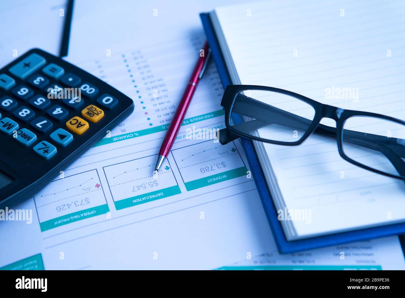 business document in office workplace with calculator Stock Photo - Alamy