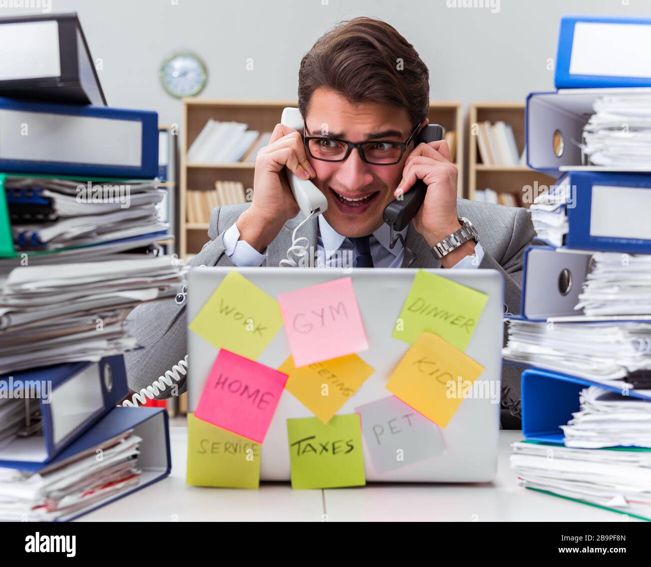 The businessman struggling with multiple priorities Stock Photo - Alamy