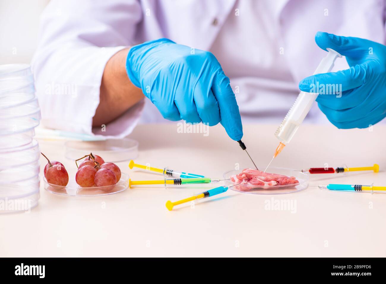 Young nutrition expert testing food products in lab Stock Photo - Alamy