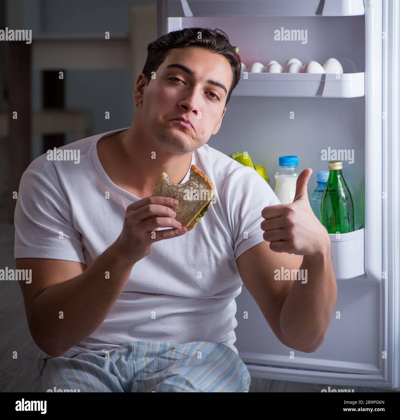 Man eating night sandwich hi-res stock photography and images - Alamy