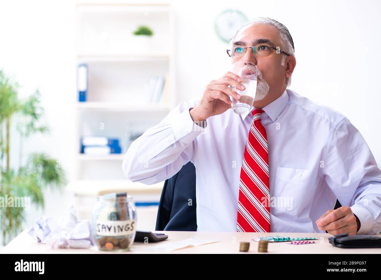 Old accountant in budget planning concept Stock Photo - Alamy