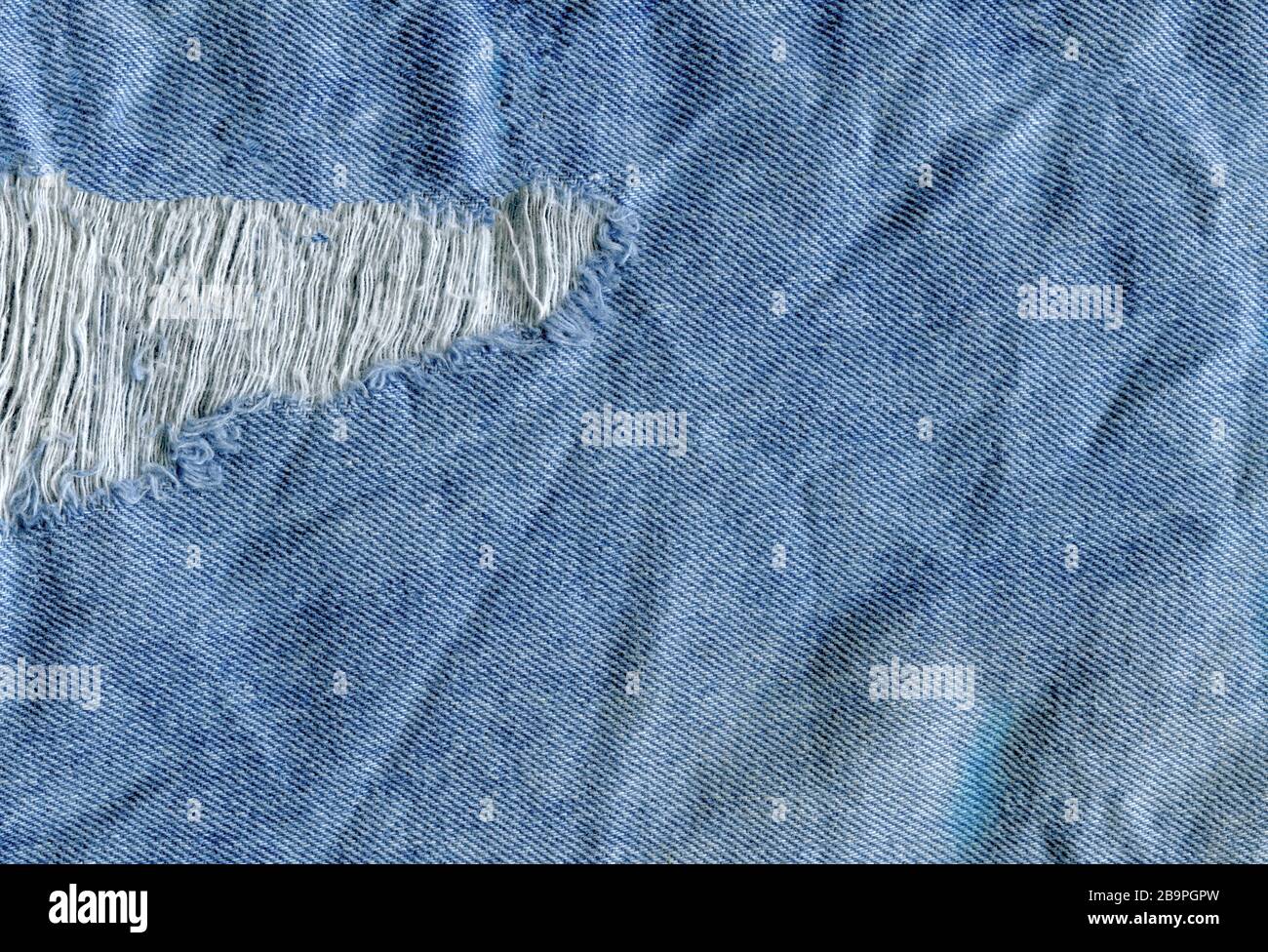 Denim jeans background with old torn. Jeans torn denim texture. Denim ...