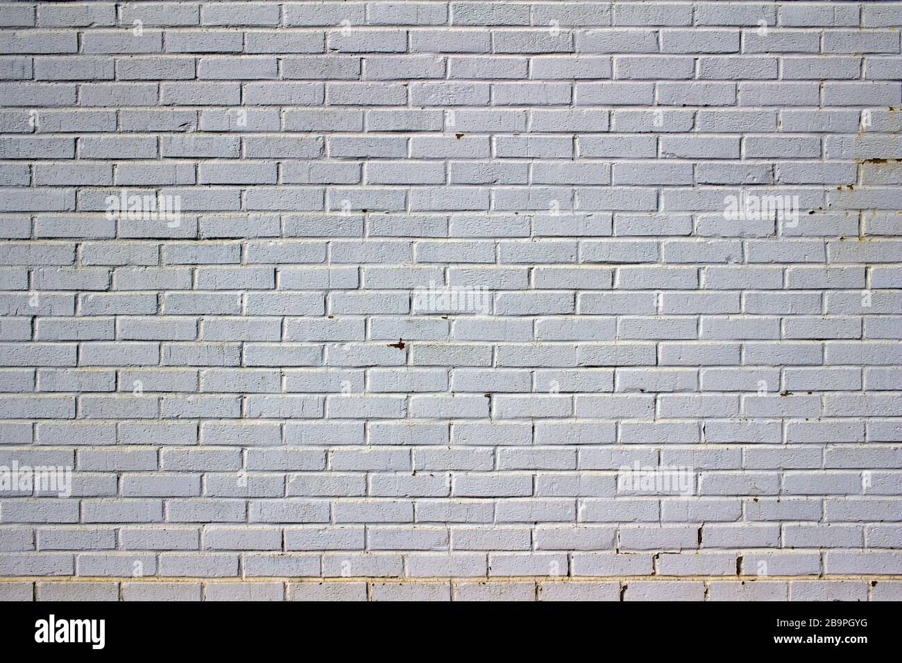 Grungy old white painted brick wall texture background with some rust ...