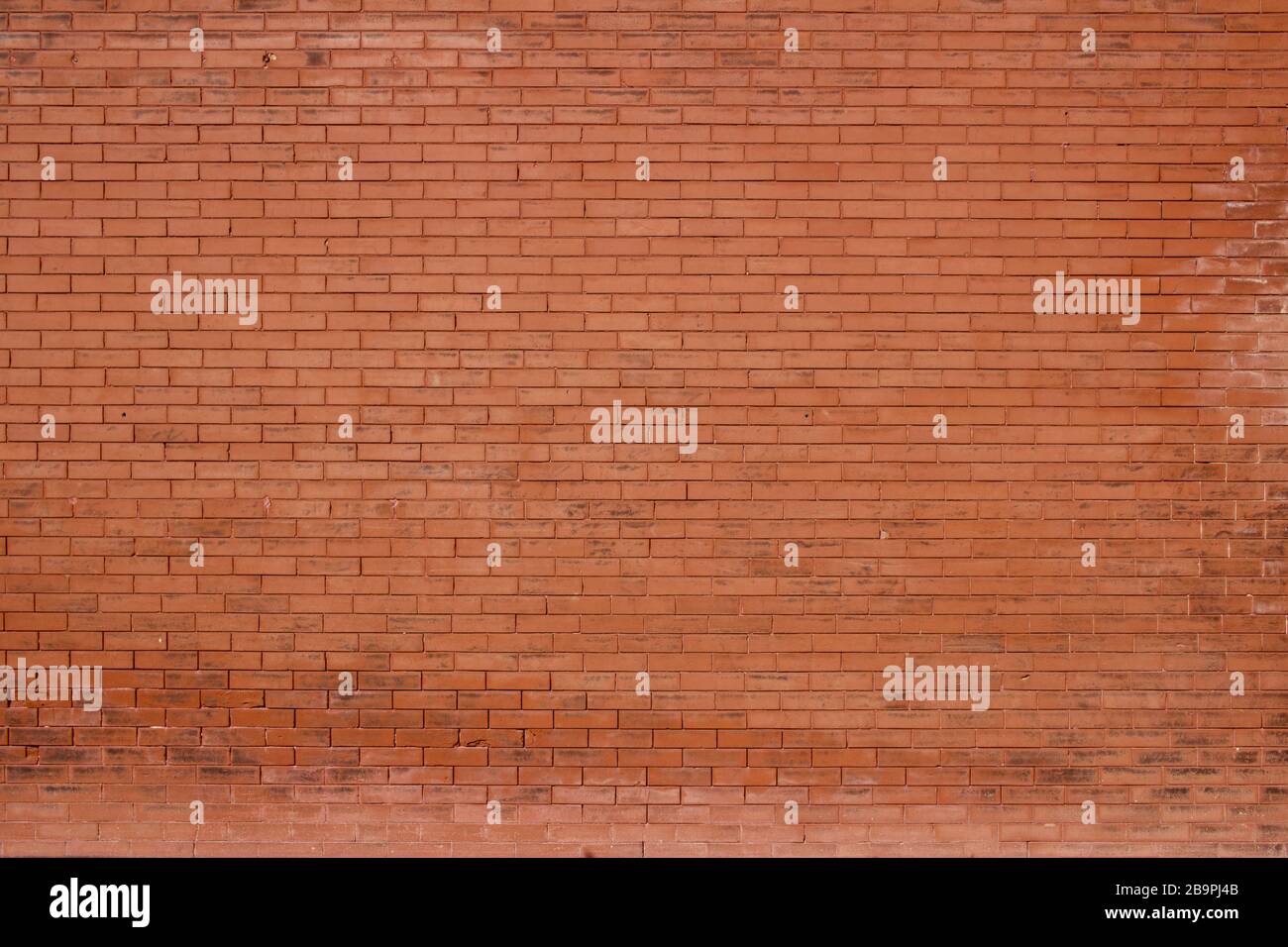 Antique burnt orange color brick wall texture background with aging ...
