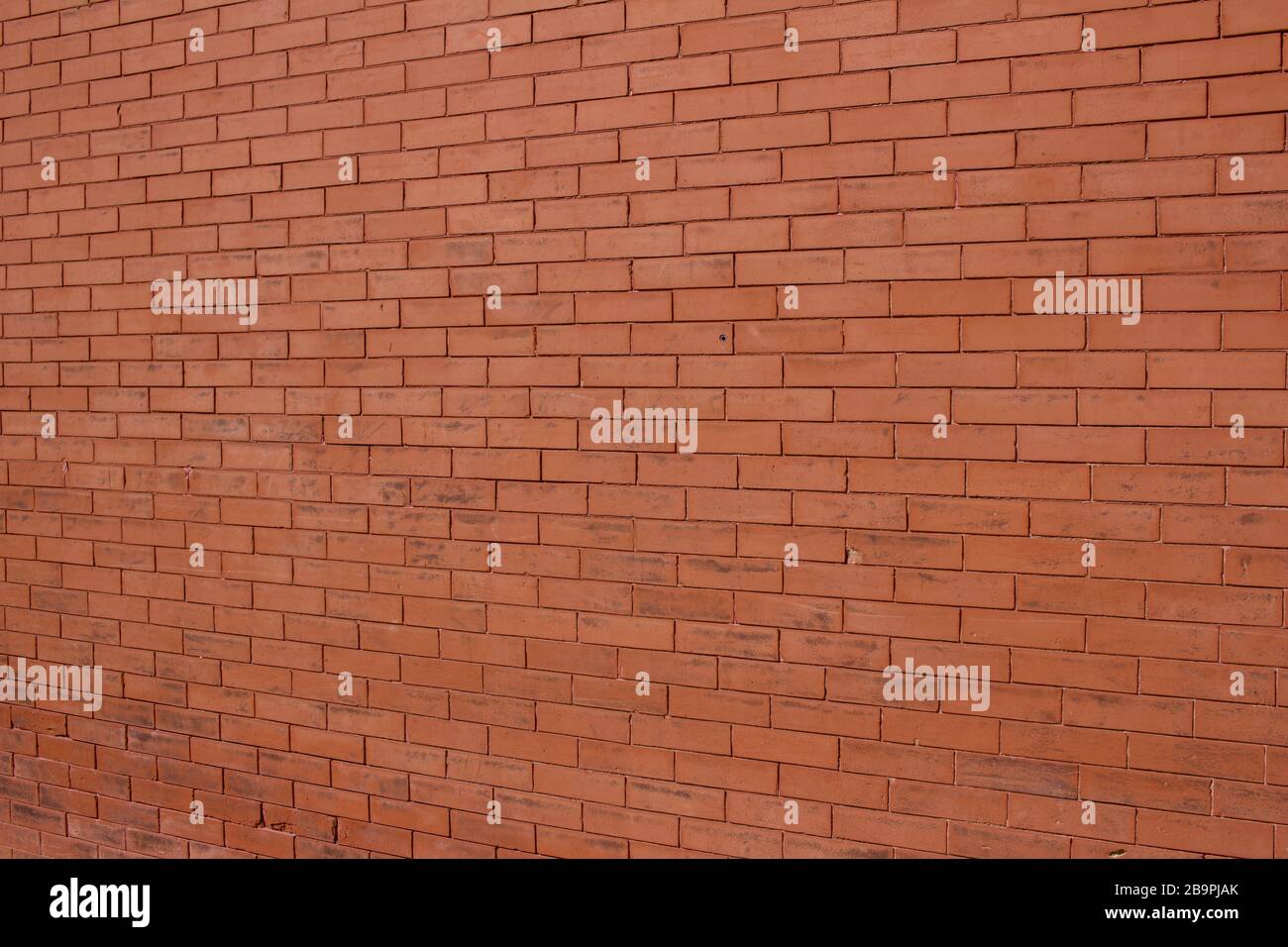 Antique burnt orange color brick wall texture background with aging ...