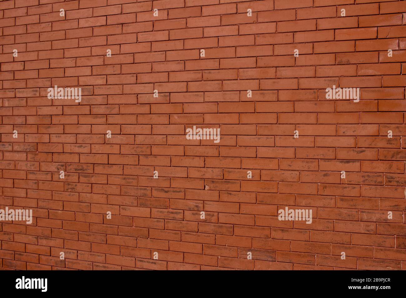 Antique burnt orange color brick wall texture background with aging ...